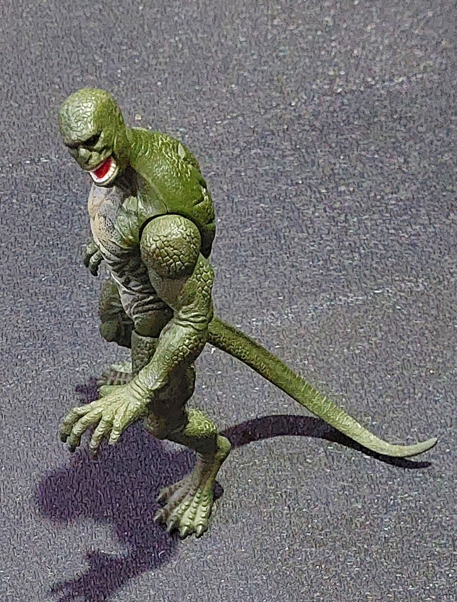 A Marvel Legends Series Lizard action figure, specifically the version ...
