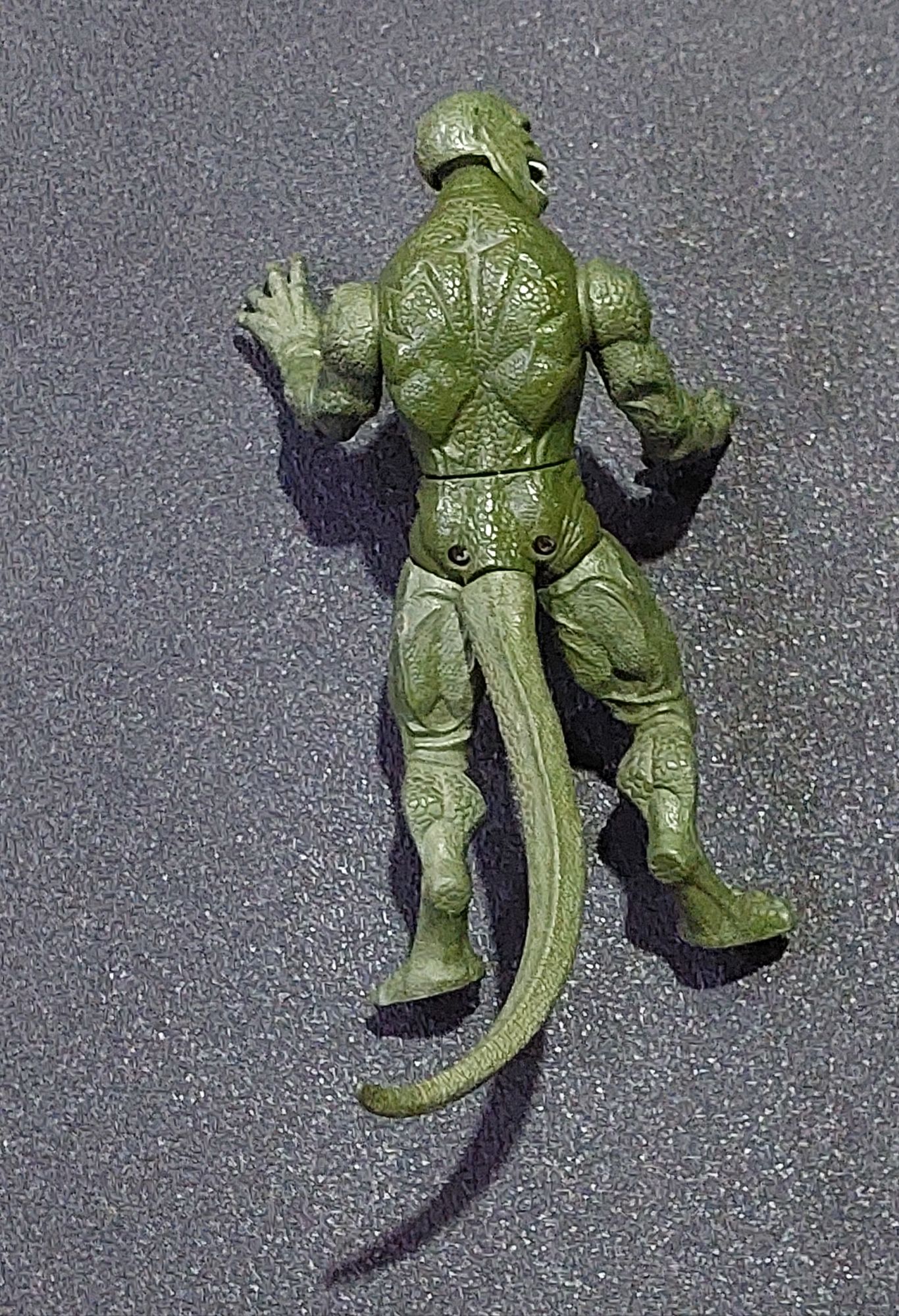 A Marvel Legends Series Lizard action figure, specifically the version ...