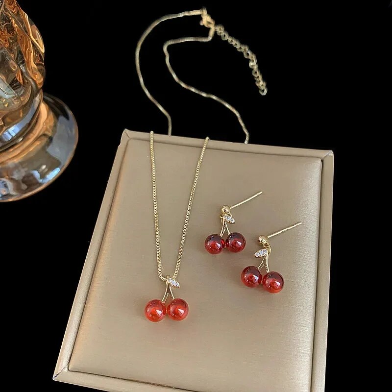 Women 2 PCS Jewelry Set Sweet Red Cherry Pendant Necklace Dangle Stud Earring Shiny Gold Box Chain White Rhinestone Jewelry Daraz.pk